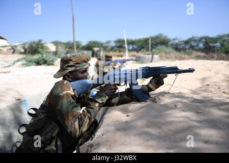Somali National Army soldiers demonstrate field military tactics during a pass-out ceremony ...