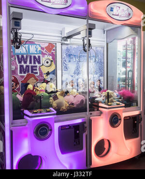 Toy grab claw machine at a funfair arcade Stock Photo - Alamy