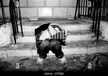 Drugs UK 1980s. Drug addict glue sniffing teenager sleeping rough on ...