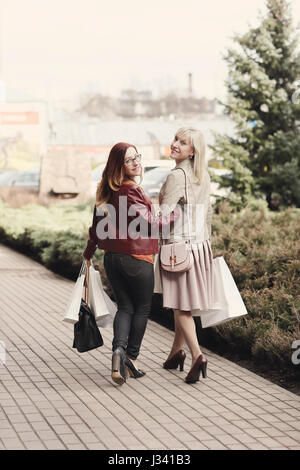 Clothing. Women went shopping together Stock Photo - Alamy