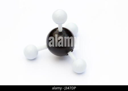 Ball-and-stick model of methane (CH4) with the periodic table of ...