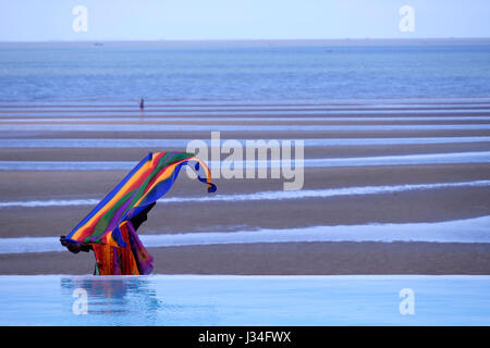 A capulana also spelled "Kapulana," a type of a sarong fabric worn ...