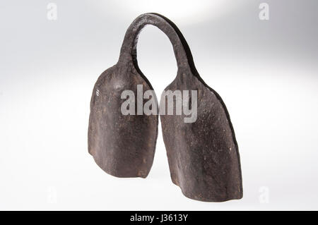 African instrument made by hand, brass, kind of bell, isolated on white ...