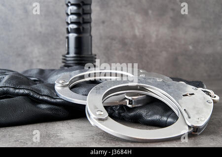 German police handcuffs on rough grey background with copy space Stock ...