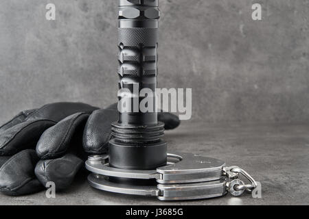 German police handcuffs on rough grey background with copy space Stock ...