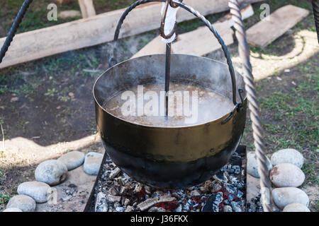 medieval reenactment, camp kitchen with cauldron, open steaming hot ...