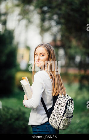 Outdoors portrait of a beautiful tanned teen student girl Stock Photo ...