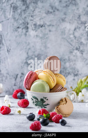Cup of coffee with french raspberry macaroons Stock Photo - Alamy