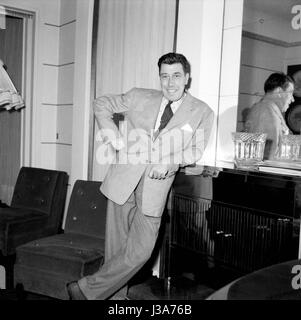 French actor Fernandel at home in his apartment located 44 avenue Foch ...