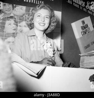 French actress Nicole Courcel signing autographs, c.1953 Stock Photo ...
