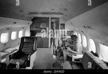 Playboy bunnies before Hugh Hefner's private jet at the Munich-Riem ...