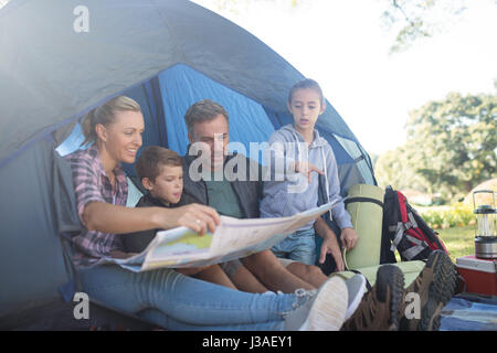 Family Reading Map At Campsite Stock Photo - Alamy