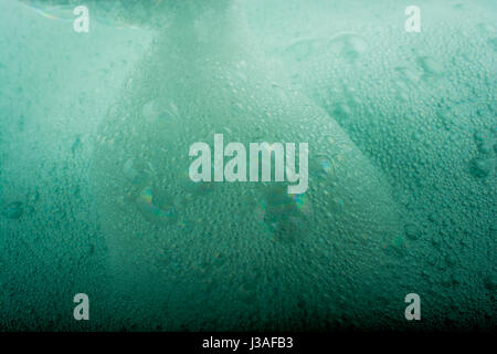 Pure water covered with foam of shampoo Stock Photo - Alamy