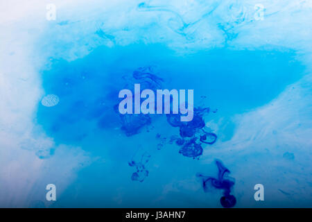 Watercolor paint dissolving in pure water Stock Photo - Alamy