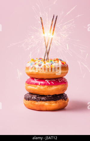 Delicious birthday cupcake with sparkler on color background Stock ...
