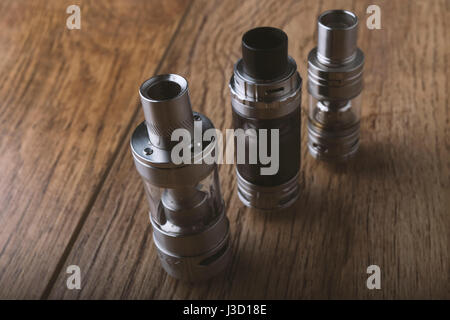 Isolated vaping devices or electronic cigarette over a wooden ...