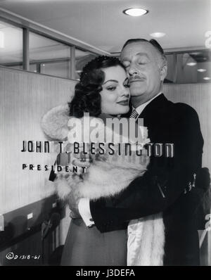 THE SOLID GOLD CADILLAC, director Richard Quine (right) with wife ...