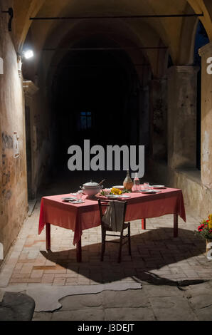 View of laid table inside a cloister Stock Photo - Alamy