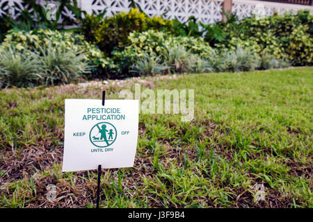 Pesticide Application warning sign on a stick in a lawn in Florida USA ...