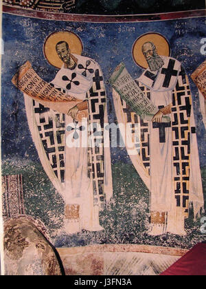 A religious fresco icon depicting a Christian saint making hand gesture ...