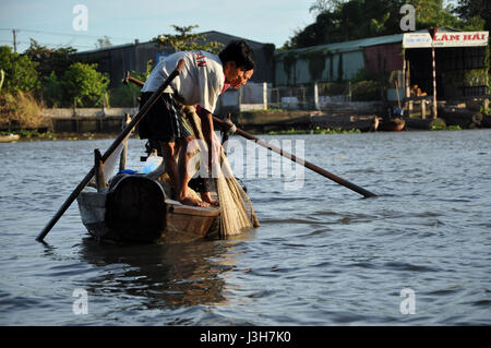 CAN THO, VIETNAM - FEBRUARY 17, 2013: Fisherman fishing with fishing ...
