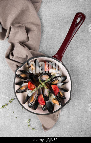 Steamed mussels served on table Stock Photo - Alamy