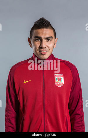 Uzbek football player Anzur Ismailov, right, of Changchun Yatai ...