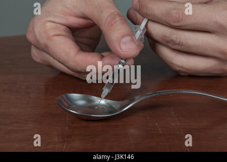 Drugs preparation begore use under studio lights Stock Photo - Alamy
