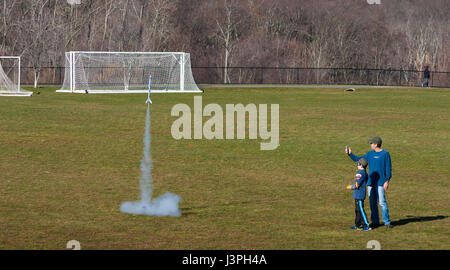 Cub Scout launching a model rocket at Millennium Park, Boston Stock ...