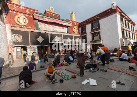 Tibetan Buddhist pilgims performing prostration in front of Jokhang ...