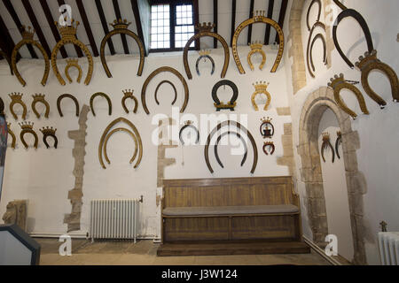 Horseshoes on the interior walls of Oakham Castle in Rutland which is ...