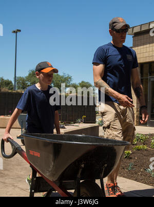 Marines and community volunteers perform maintenance and landscaping ...
