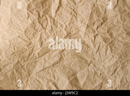Creased parchment paper background texture with dark burned effect ...