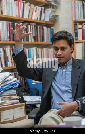 Rana Mitter surrounded by books at Oxford University Stock Photo - Alamy