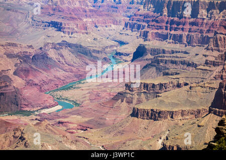 Aerial view of rugged desert landscape with deep red canyon formations ...