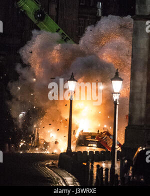 A van is exploded on the Royal Mile in Edinburgh for the upcoming movie ...
