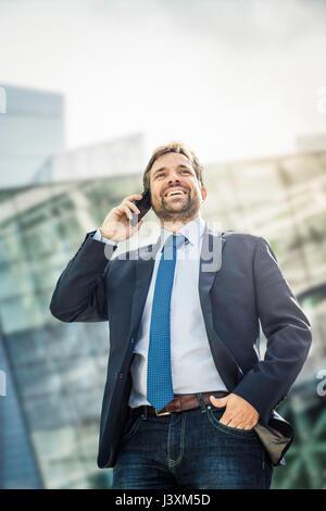 Happy business man making a call Stock Photo - Alamy