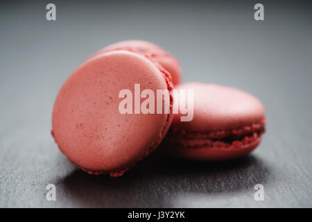 bright pink macarons on slate background with copy space Stock Photo ...