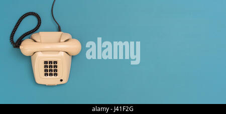 a vintage landline telephone for calling, retro phone set on a table a ...