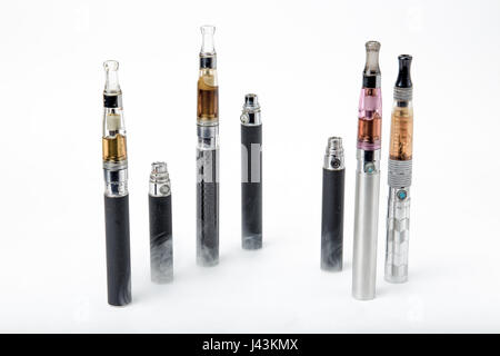 Thin e-cigarettes on white background Stock Photo - Alamy