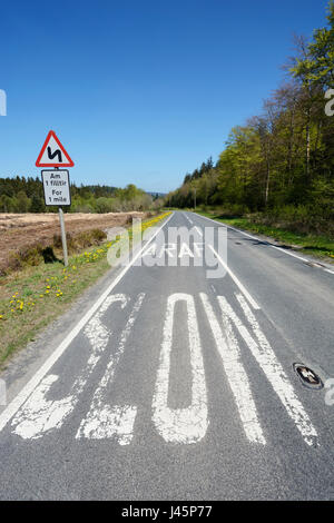 SLOW ARAF bilingual welsh english language road markings on bend on ...