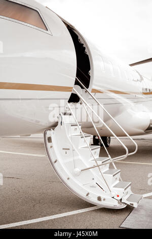 Business jet ladder Stock Photo - Alamy
