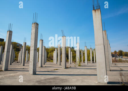 Pile foundation frame house. Piles of concrete and the base of the ...