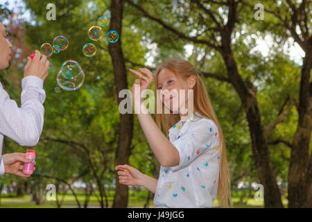 Female touching bubble Stock Photo - Alamy