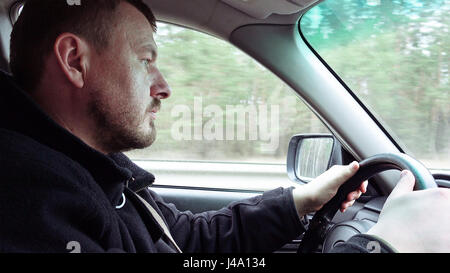 Car driving fast on intercity road at sunset. Highway traffic in ...