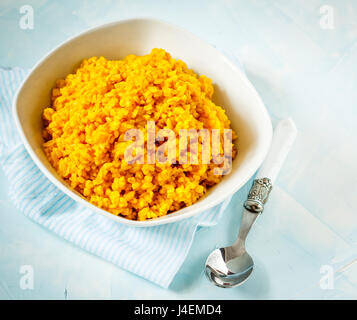 Bowl of tasty boiled quinoa on light background with space for text ...