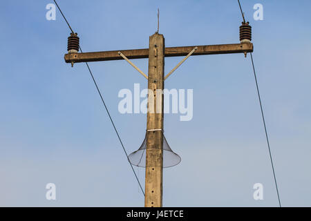Nylon mesh or snake guard net around electric pole for protect animals ...