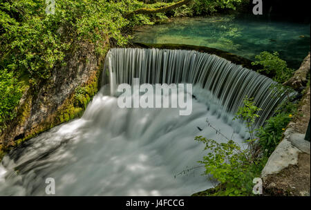 Semicircular dam that cause waterfall Stock Photo - Alamy