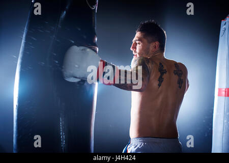 Muscular young man leaning back Stock Photo: 85862268 - Alamy