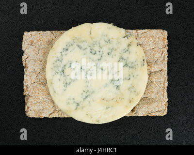 Blue Stilton Cheese on Thin Crisp Wholewheat Crackers On An Oven Tray ...